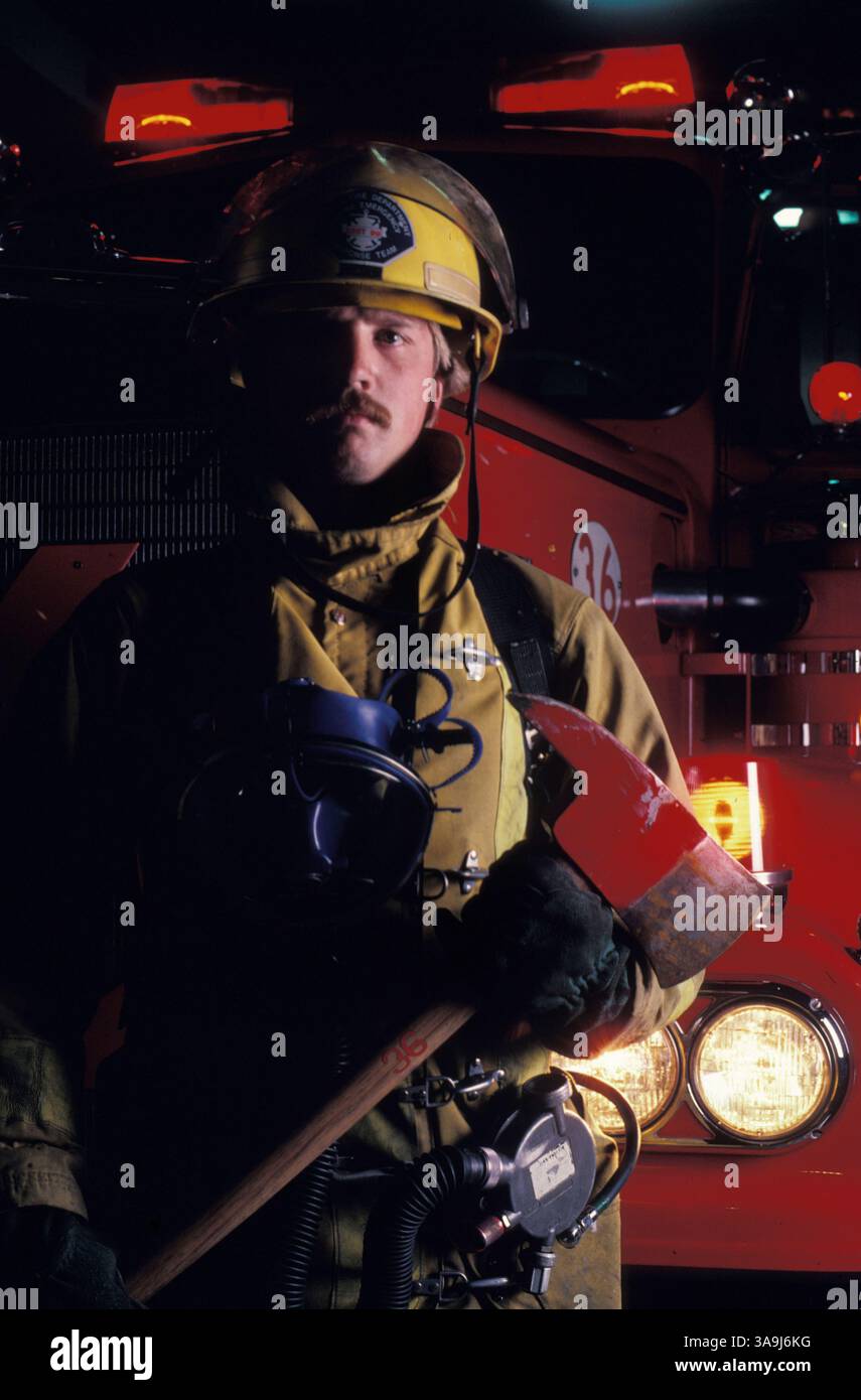 May 18, 1986; Seattle, WA, USA; A fireman posing in uniform in front of ...