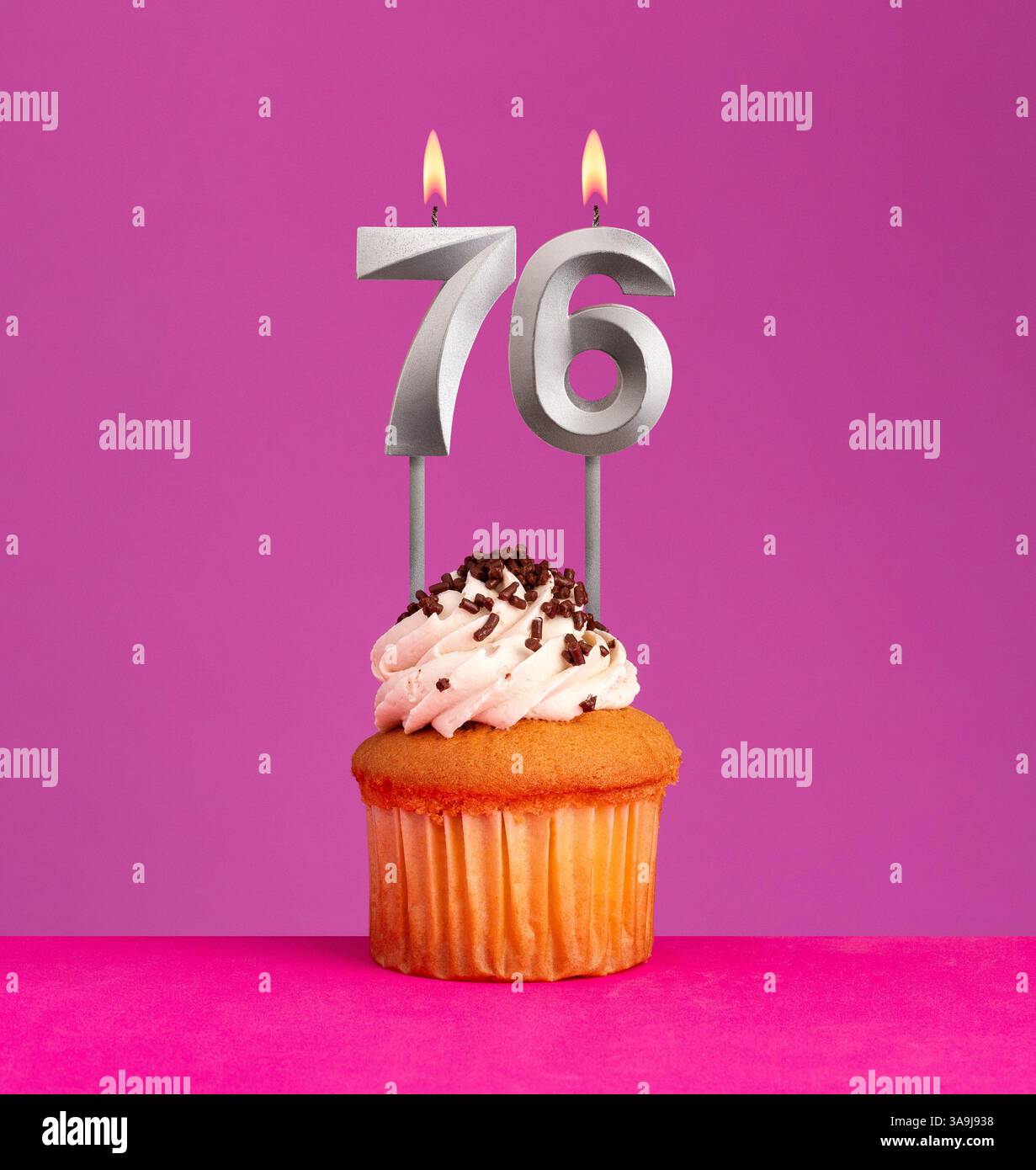 Birthday card on violet background - Candle number 76 Stock Photo - Alamy