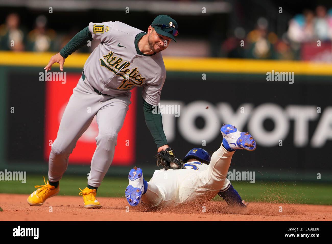 Athletics second baseman Max Schuemann tags Seattle Mariners' Dylan ...