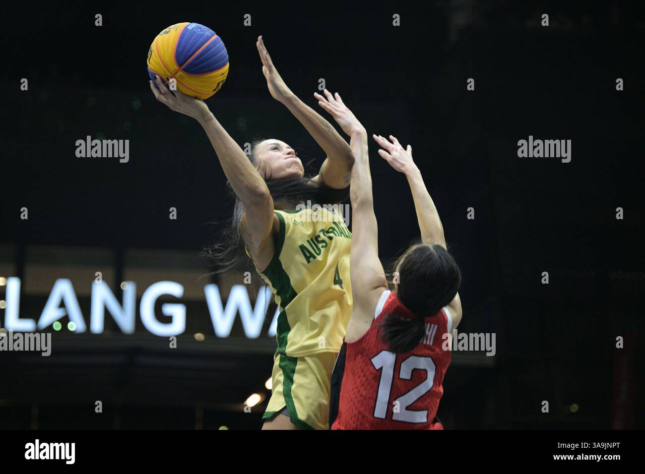 Singapore. 30th Mar, 2025. Alex Wilson (L) of Australia goes to basket ...