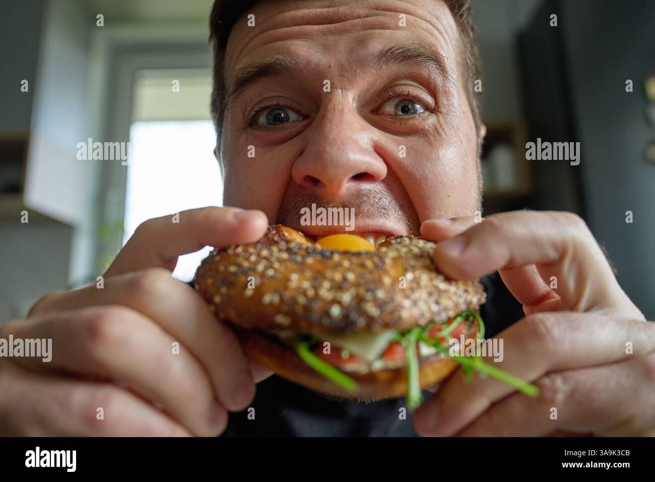 Person takes big bite tasty hi-res stock photography and images - Alamy