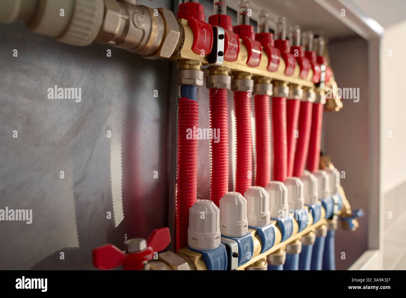 Underfloor heating manifold with control valves, flow meters and ...