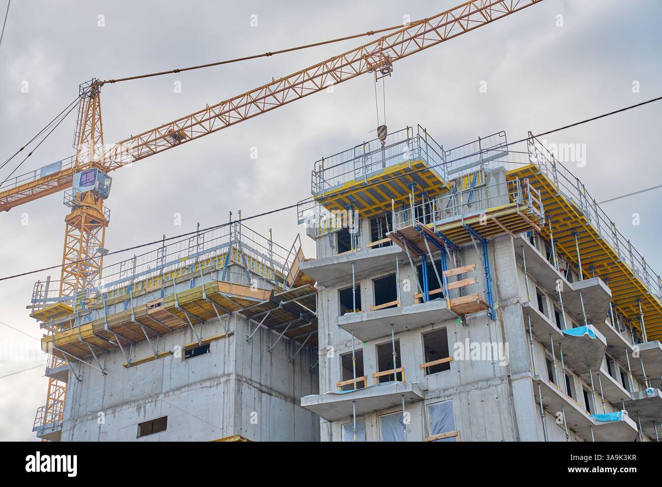 Unfinished concrete multi story building under construction with ...