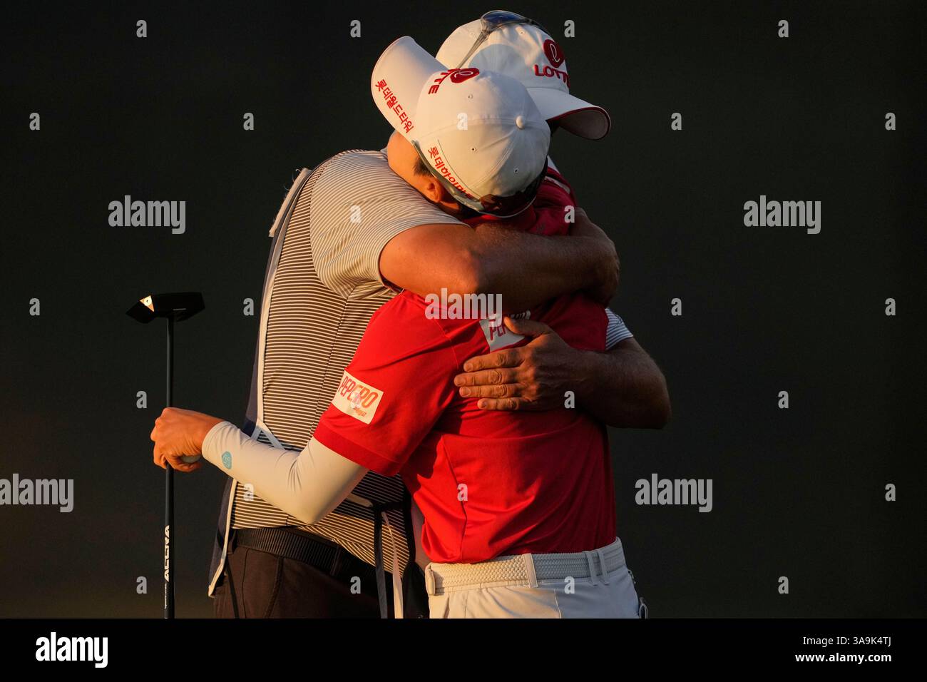 Hyo Joo Kim, of South Korea, hugs her caddie after winning on the 18th ...