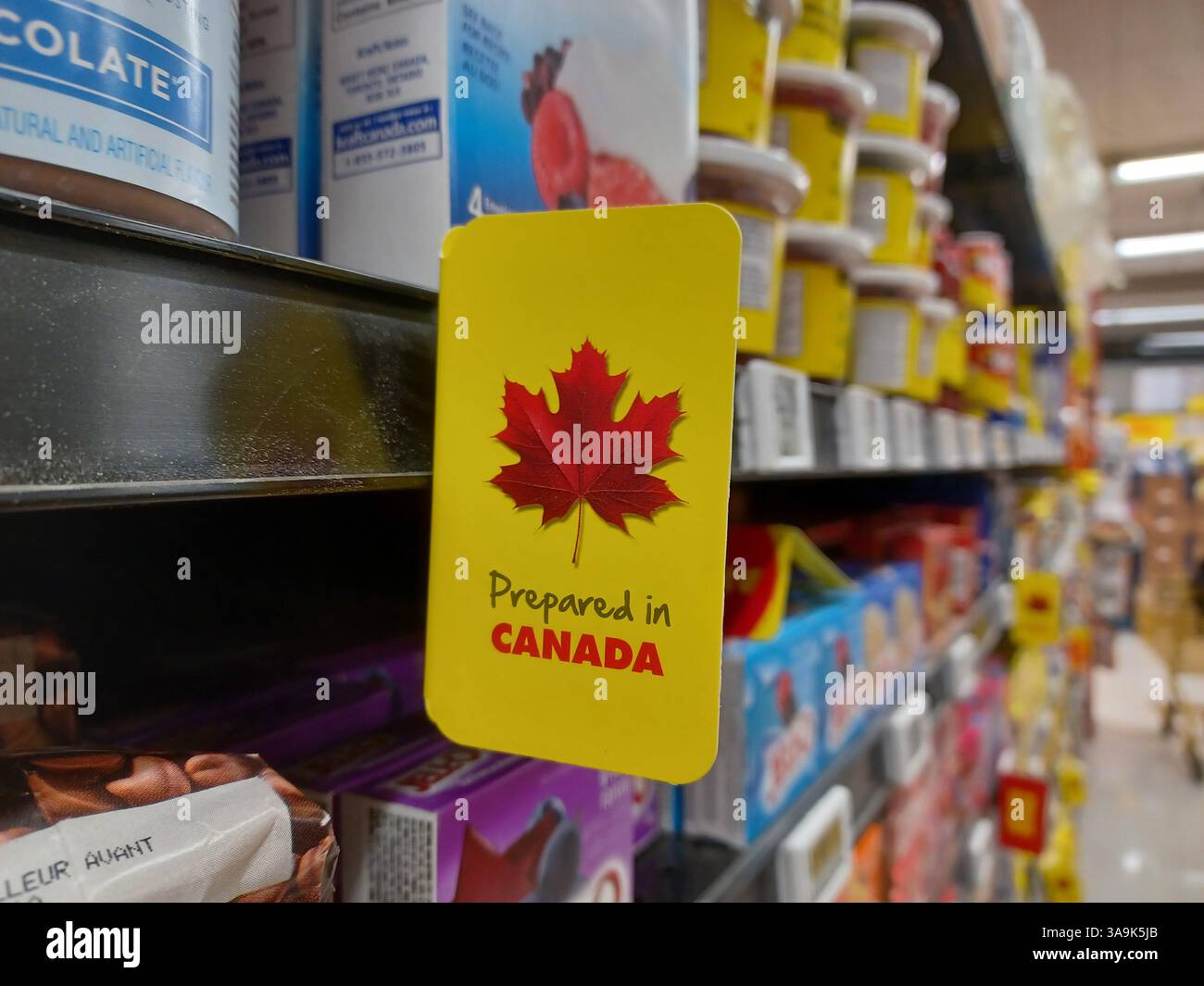 Toronto, ON, Canada – March 5, 2025: Close-up of a yellow shelf tag ...