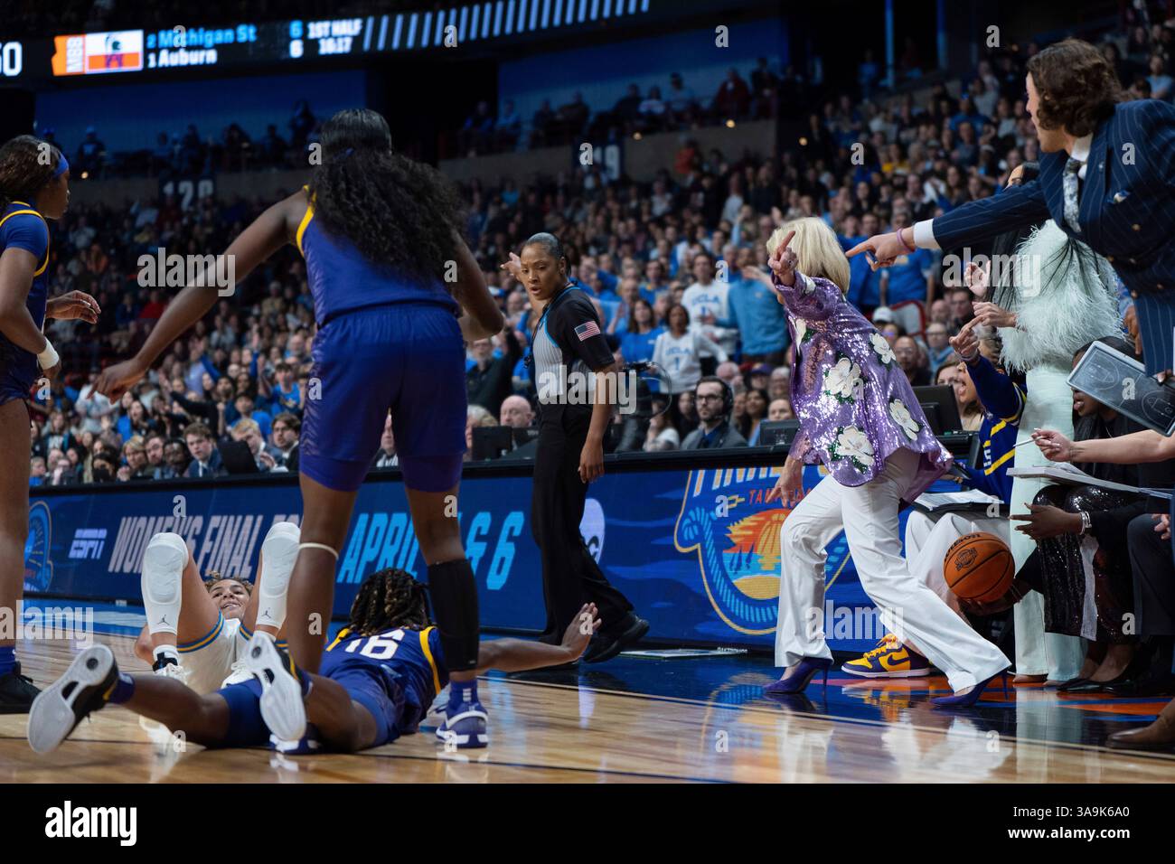 A referee calls position after the ball went out of bounds during the ...