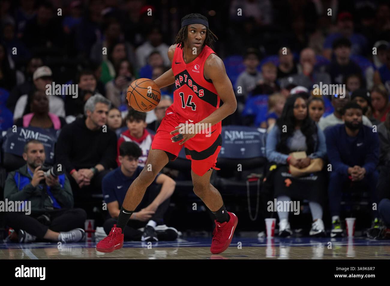 Toronto Raptors' Ja'Kobe Walter plays during an NBA basketball game Sunday, March 30, 2025, in ...