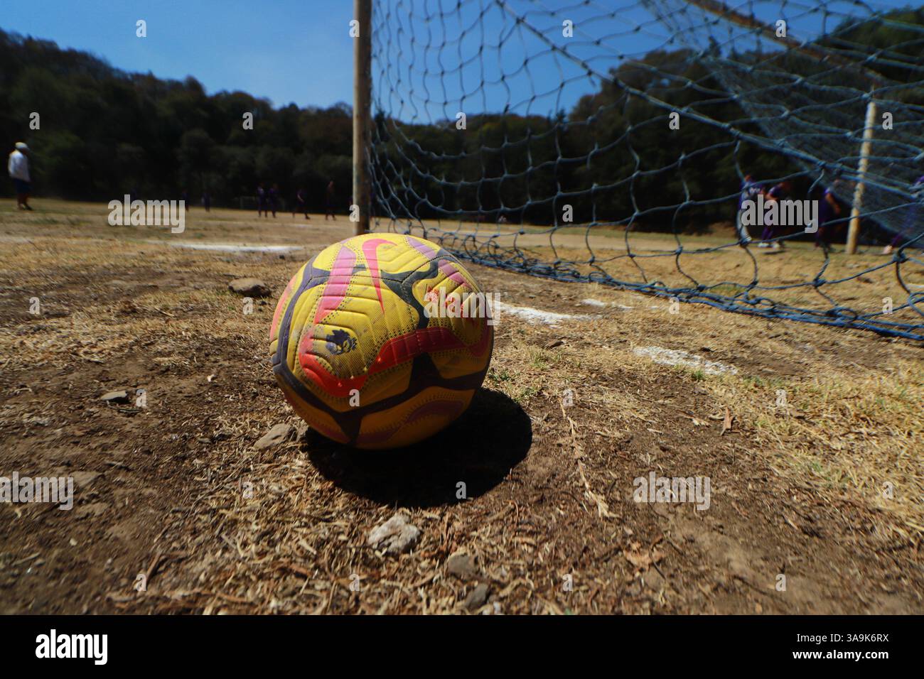 a ball is seen during a soccer match at soccer field, know as Gods ...