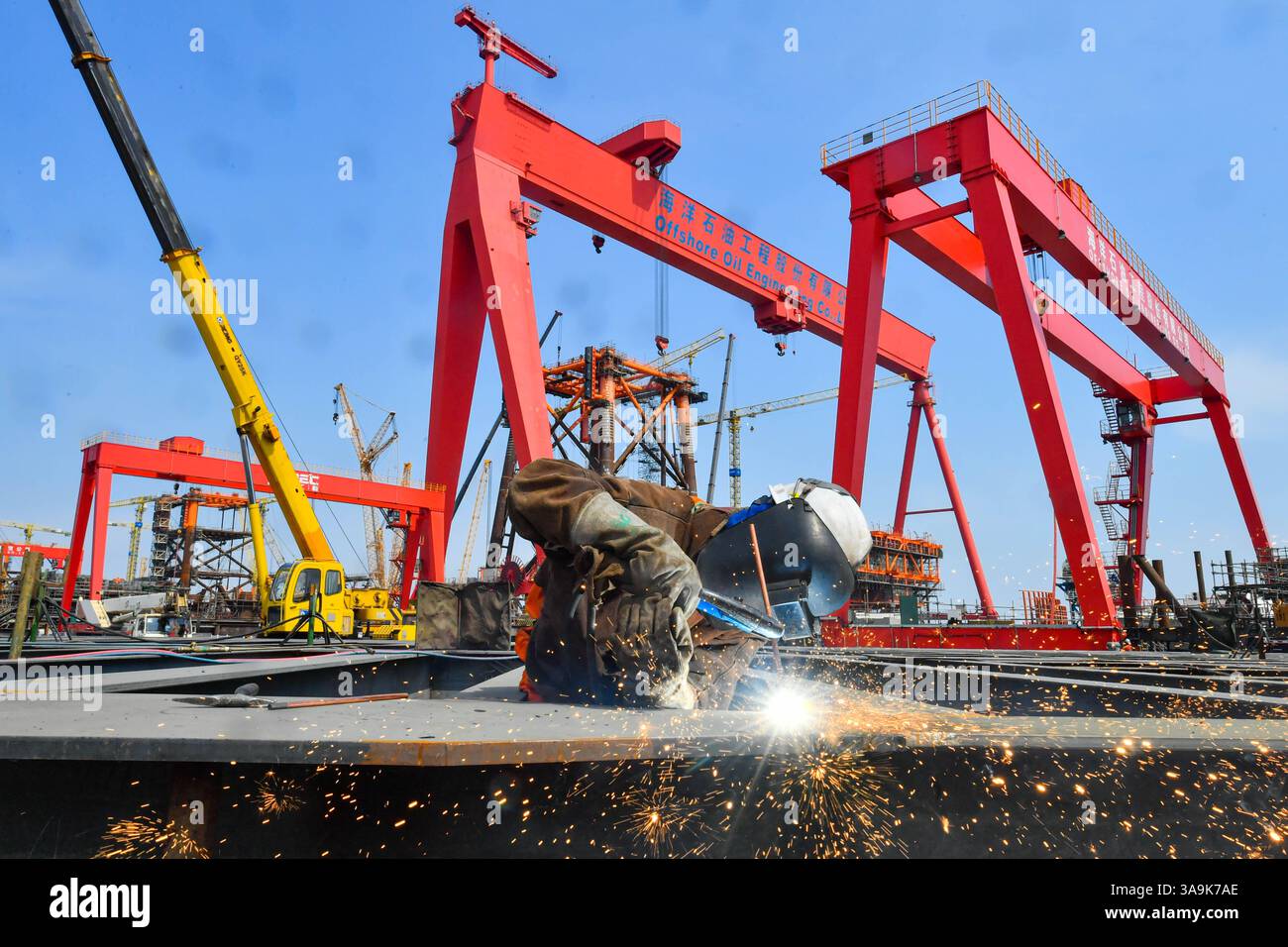 Beijing, China. 30th Mar, 2025. A worker prefabricates steel for Bohai ...