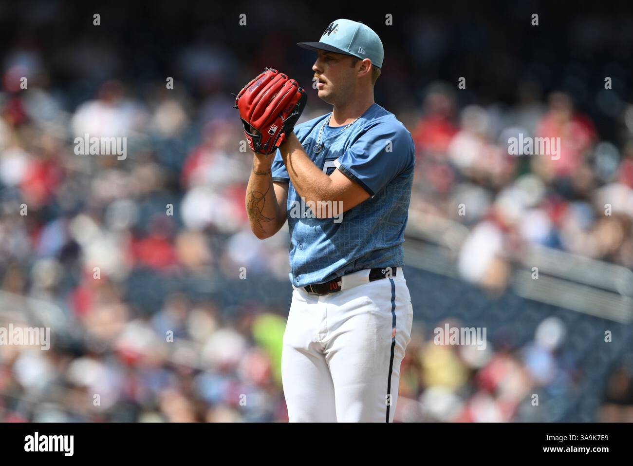 Washington Nationals pitcher Mitchell Parker sets the throw during the ...