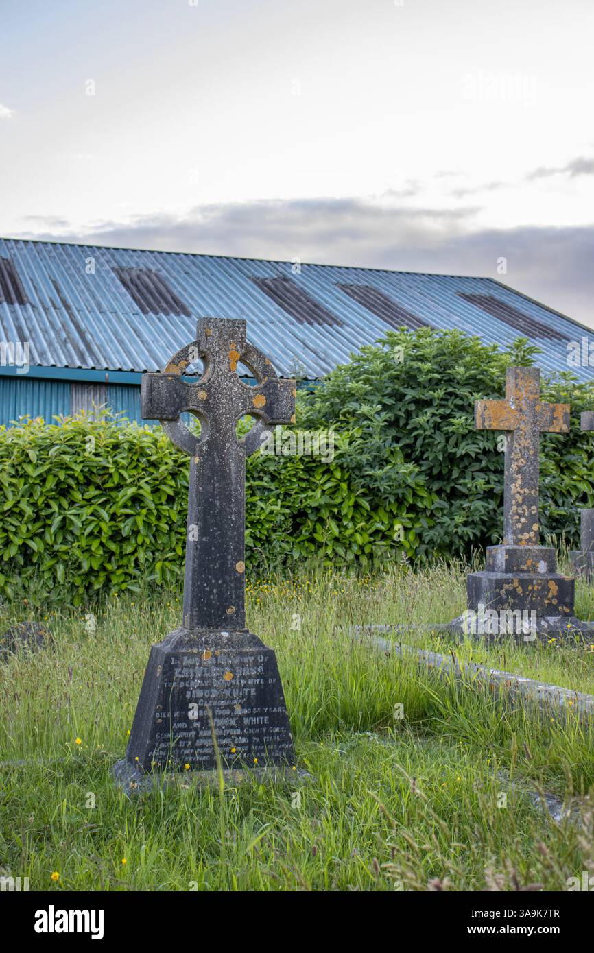 Tombstones in a graveyard at the Church of the Resurrection in Blarney ...