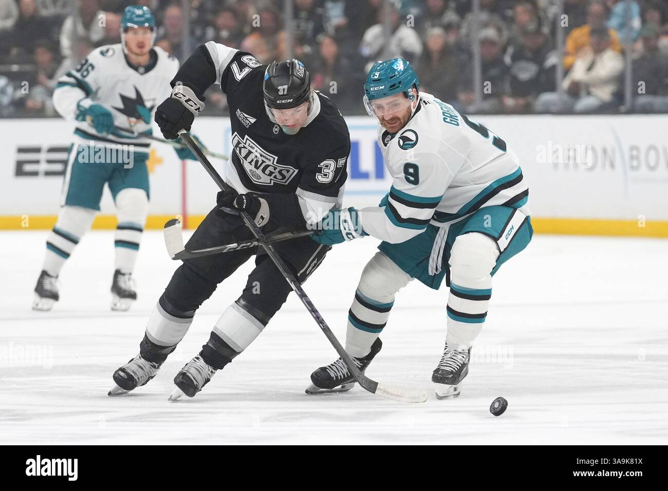 Los Angeles Kings left wing Warren Foegele, center, and San Jose Sharks ...