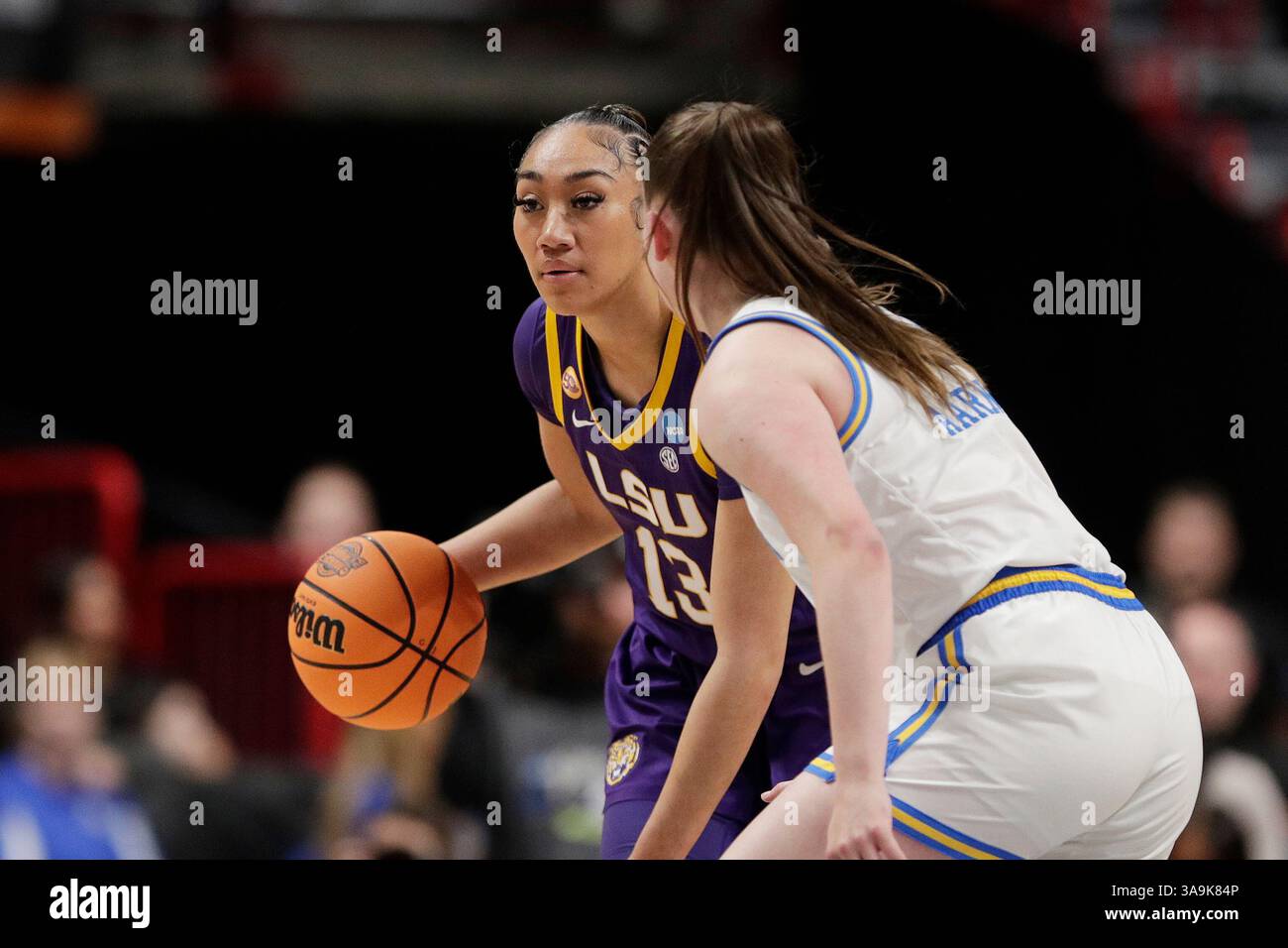 LSU guard Last-Tear Poa (13) controls the ball while pressured by UCLA ...