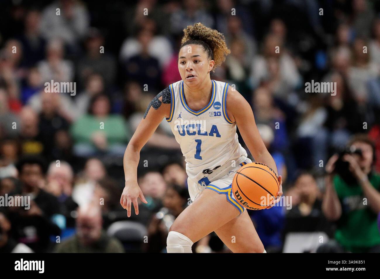 UCLA guard Kiki Rice (1) controls the ball during the second half ...