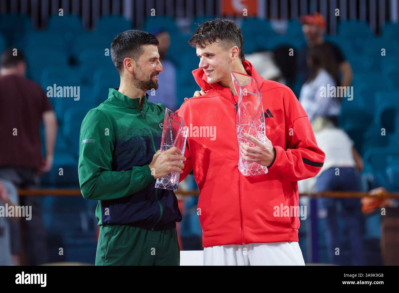 MIAMI GARDENS, FL - MARCH 30: Jakub Mensik (CZE) receives the Butch ...