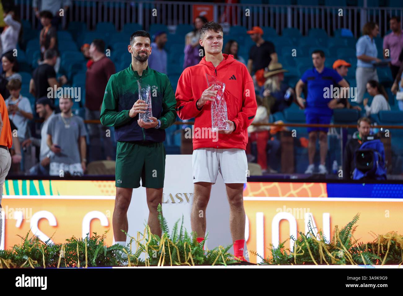 MIAMI GARDENS, FL - MARCH 30: Jakub Mensik (CZE) receives the Butch ...