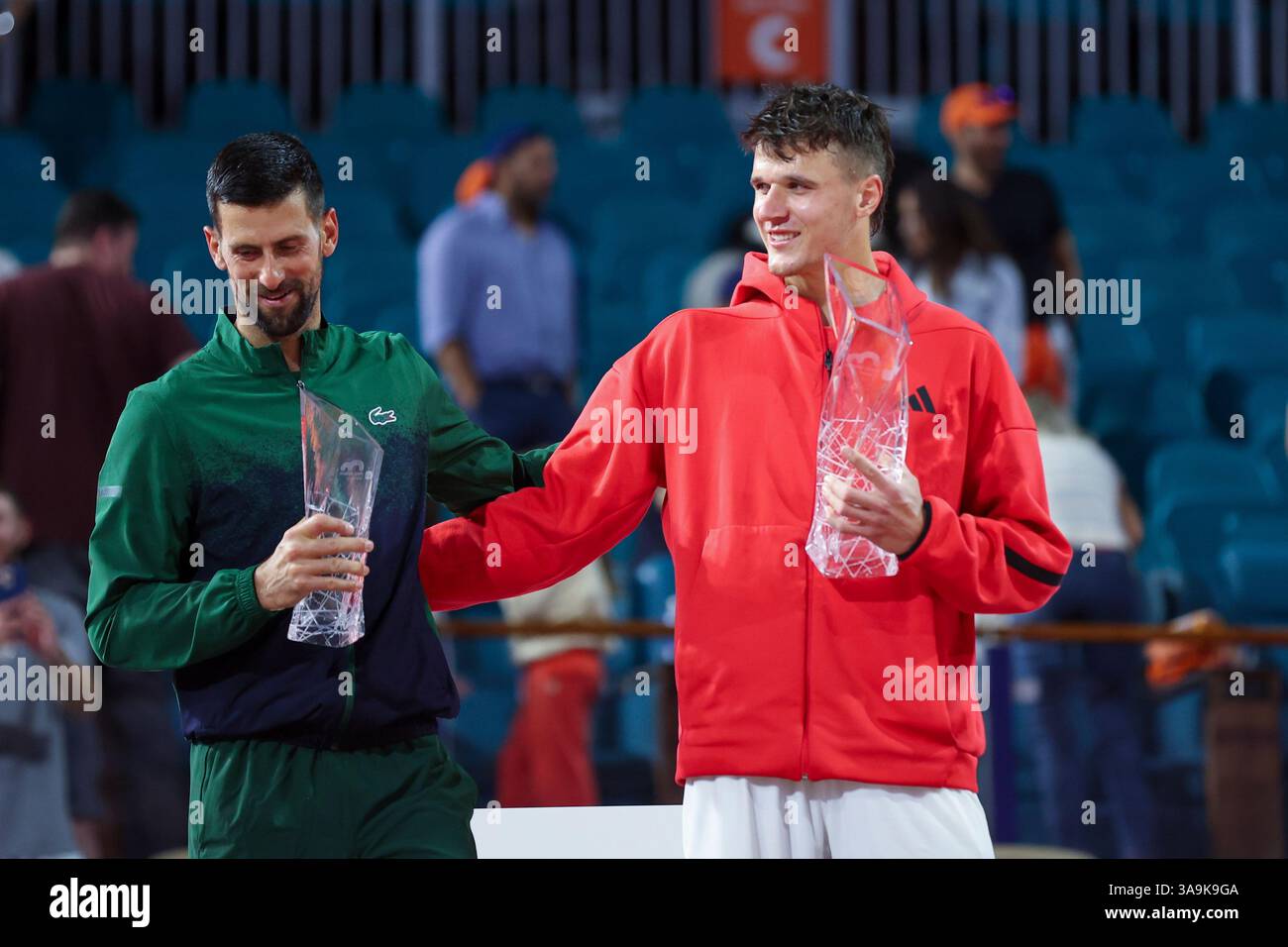 MIAMI GARDENS, FL - MARCH 30: Jakub Mensik (CZE) receives the Butch ...