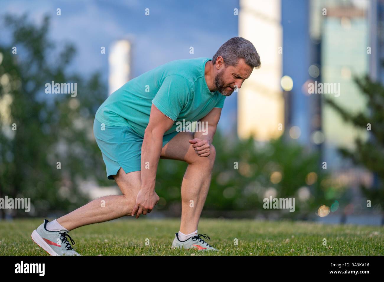 Knee after sport. Athletic man suffering from knee pain. Injured man ...