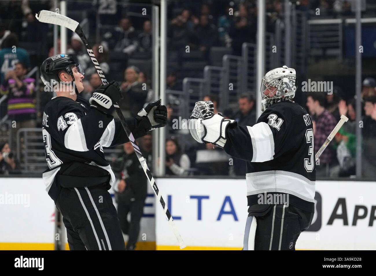 Los Angeles Kings defenseman Jacob Moverare, left, and goaltender David ...