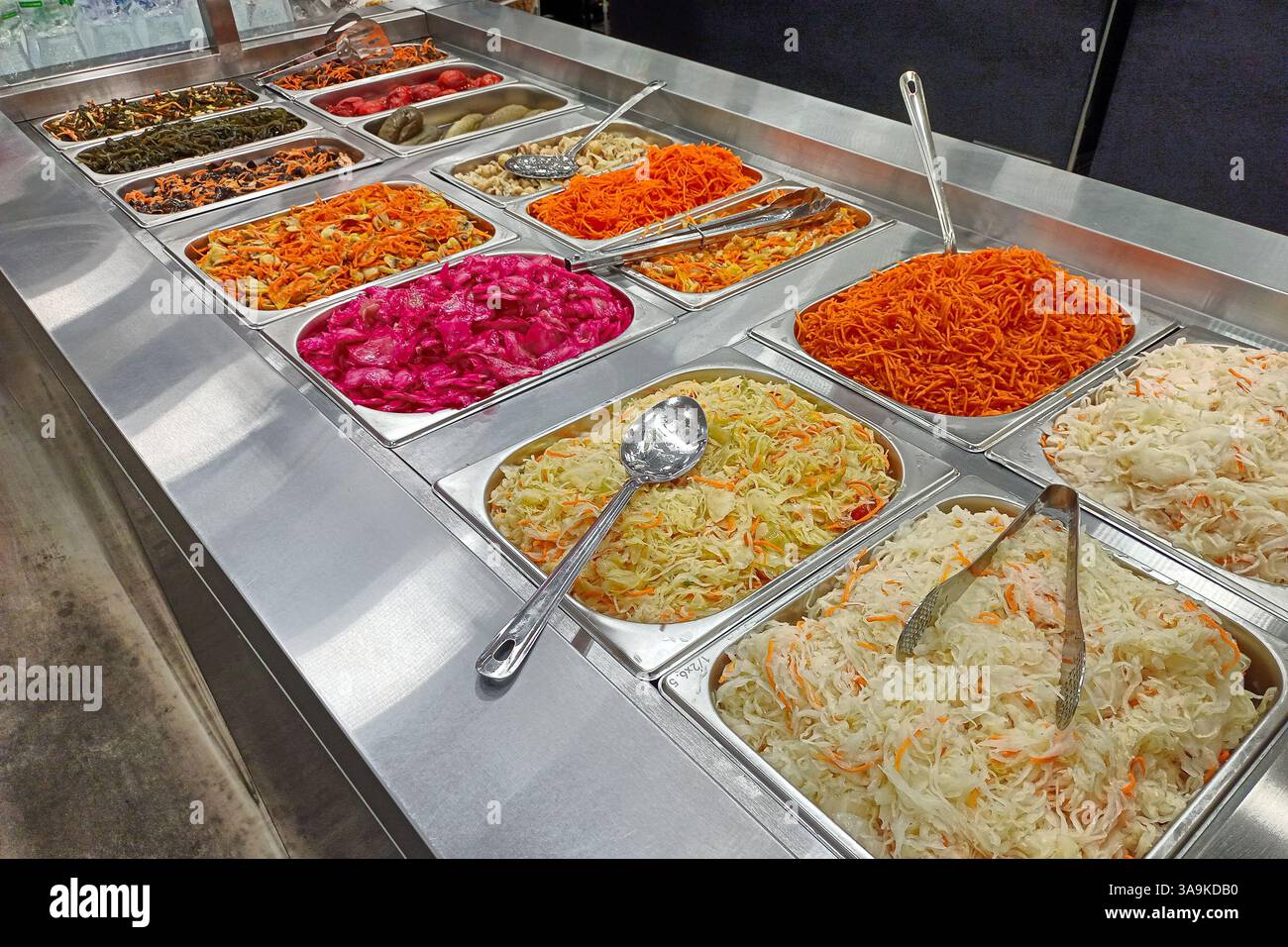 Self-Service Salad Bar with Various Pickled Vegetables, featuring a ...