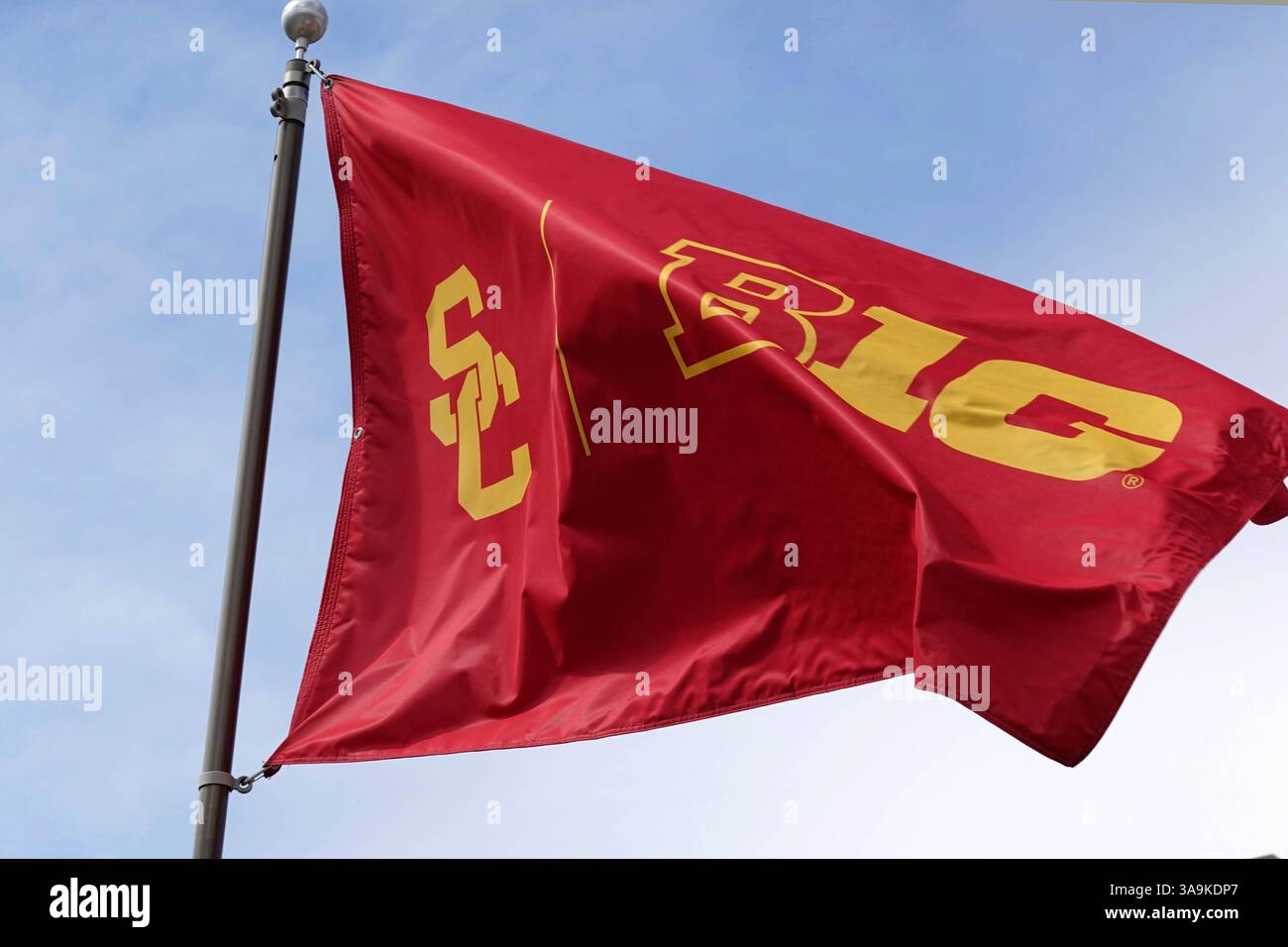 A flag with the USC Trojans and Big Ten Conference logos at the ...