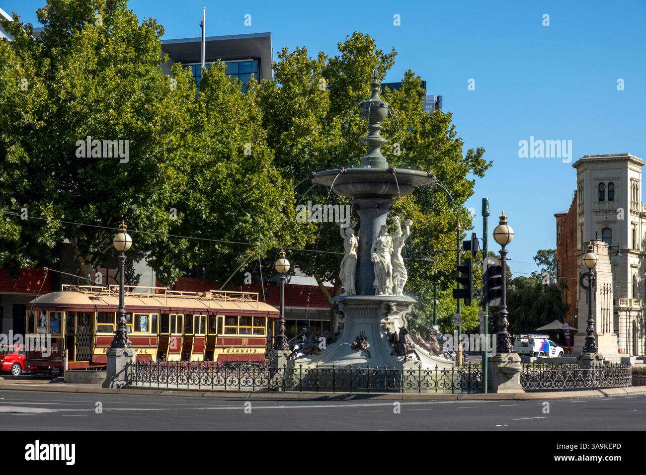 A tram parked next to the Alexandra Fountain in Central Bendigo ...