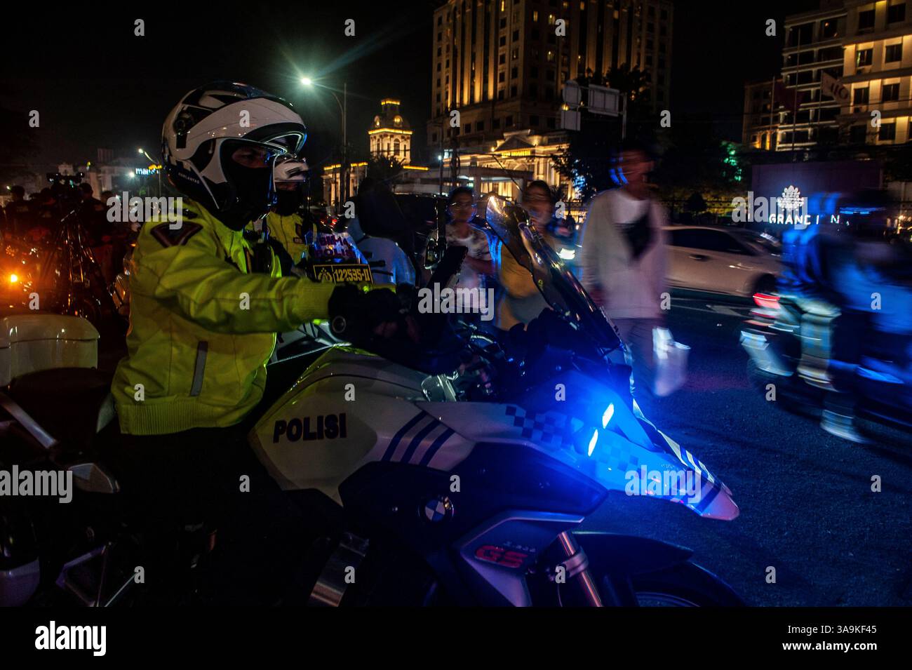 Madan, Indonesia. 30th Mar, 2025. Polce personnel are seen during ...