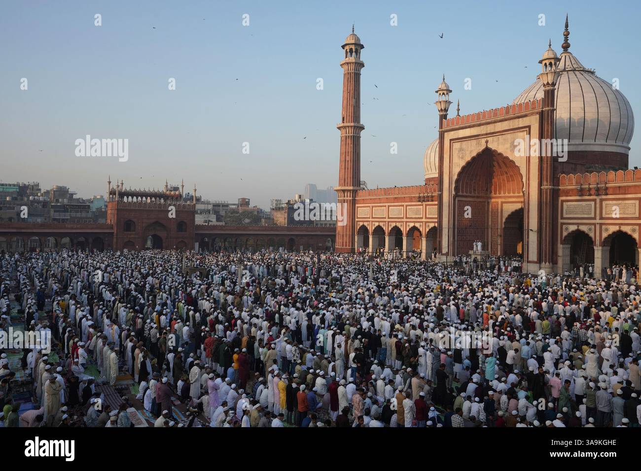 Muslims perform an Eid al-Fitr prayer marking the end of the holy ...