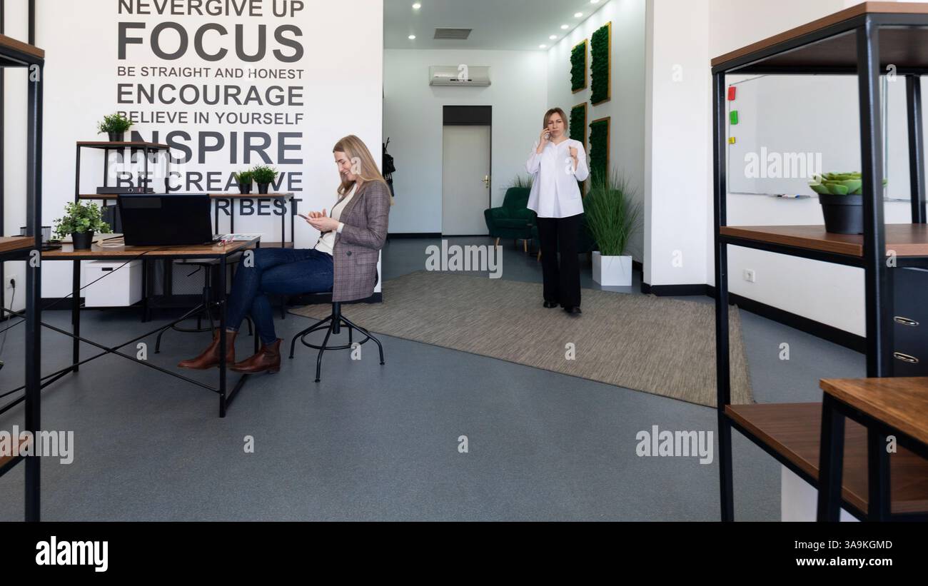 Modern coworking space featuring professionals engaged in collaborative ...