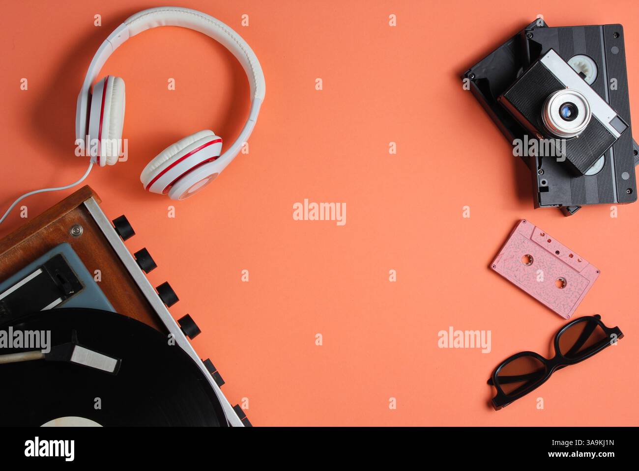 Flat lay retro 80s pop culture objects. Vinyl player, headphones, audio ...