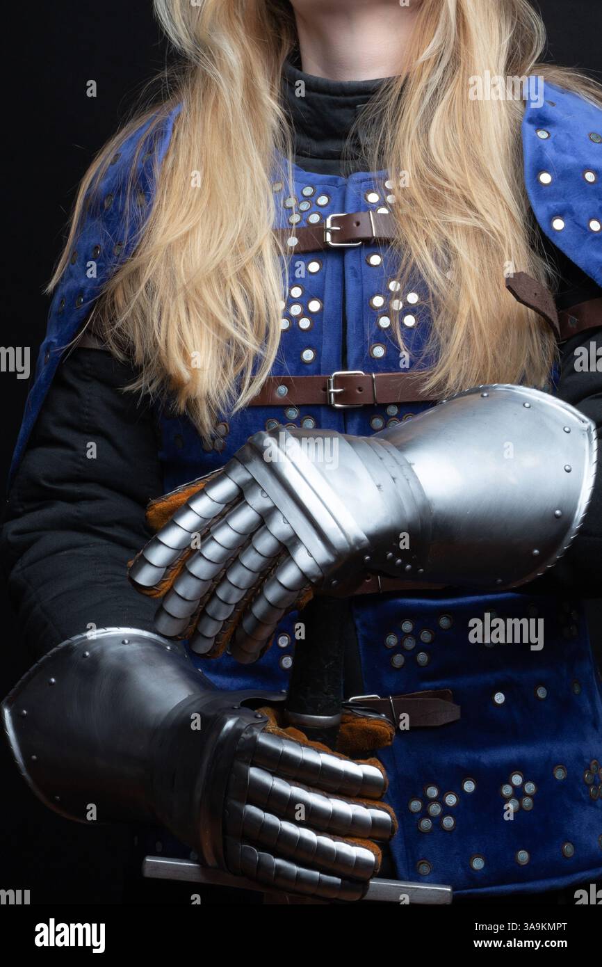 Medieval Knight Holding Sword in Full Armor Stock Photo - Alamy