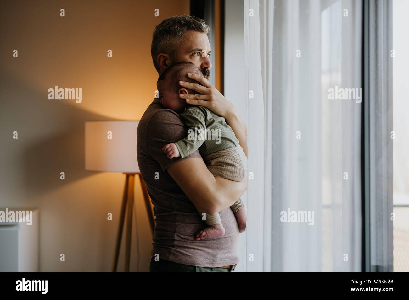Father comforting his crying baby son Stock Photo - Alamy