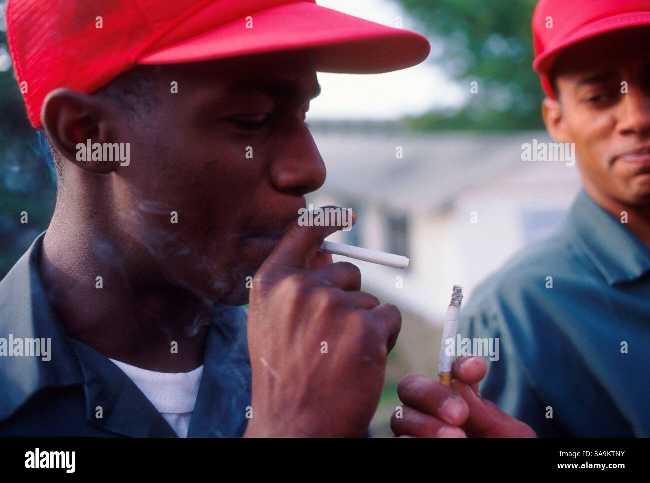 Jun 21, 1995; Schoharie, NY, USA; Inmates share a cigarette during a ...