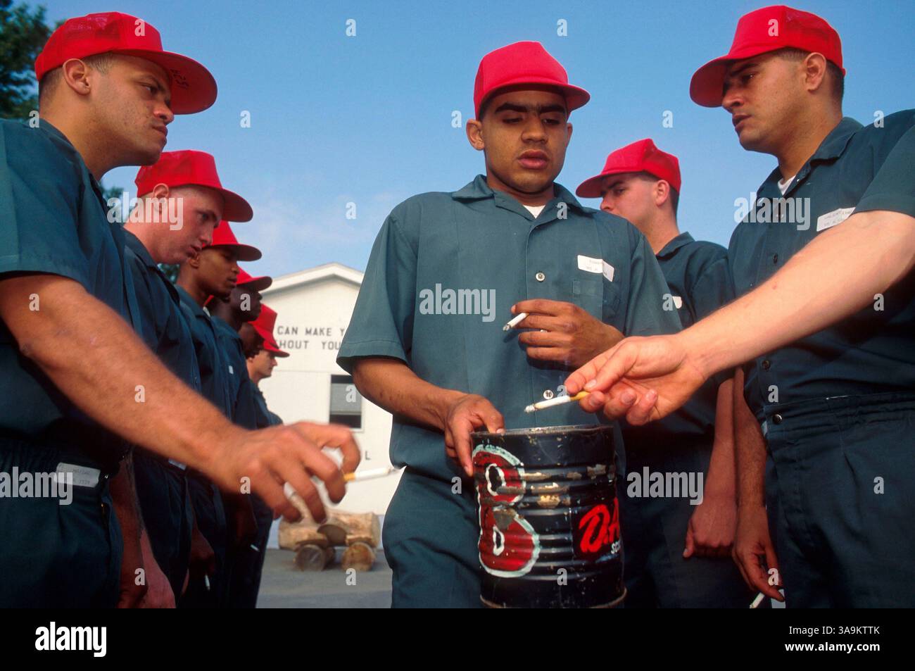 Jun 21, 1995; Schoharie, NY, USA; Inmates smoke during a break in their ...