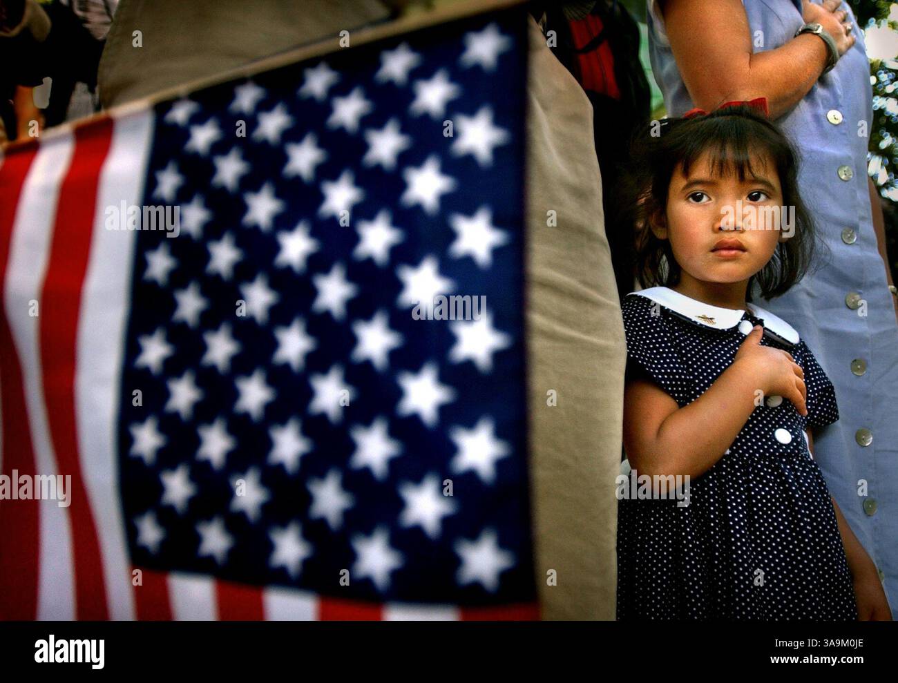 Grace Fernandez (CQ) age 3, holds her hand over heart during the ...