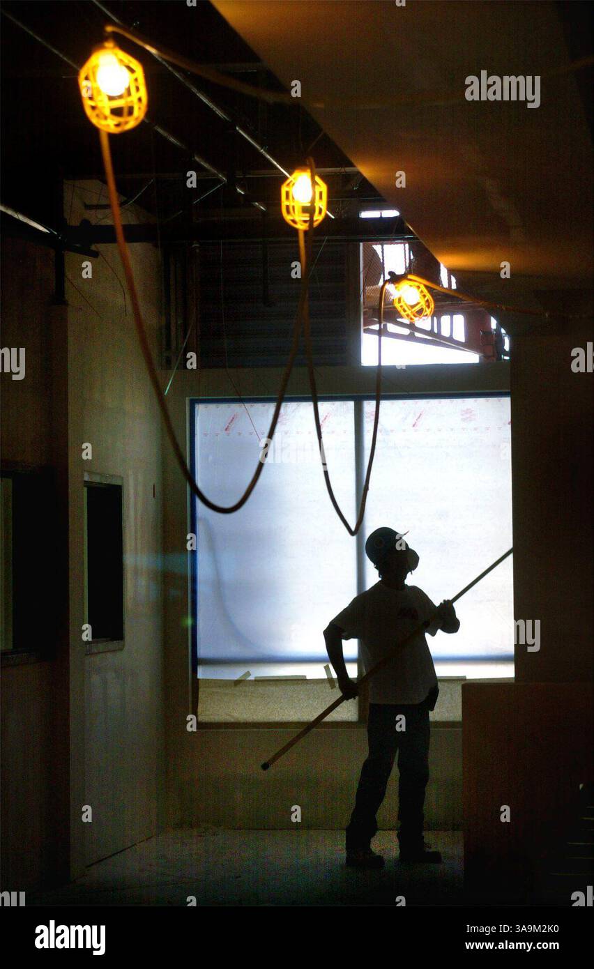 LEDE-- A construction worker works on the new Rosemont High School on ...