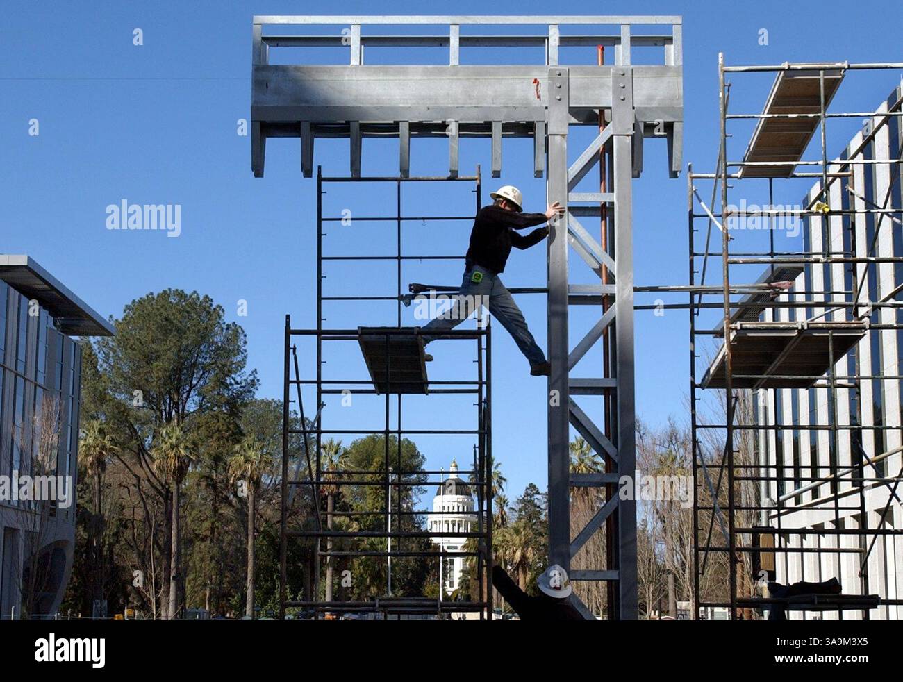 COVER SECONDARY: Jason Bunch works on scaffolding to prepare for the ...