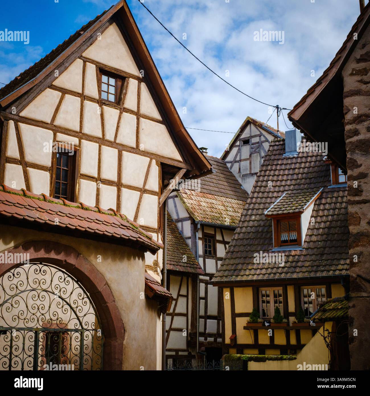 squared view of medieval houses corners with windows and wood crafted ...
