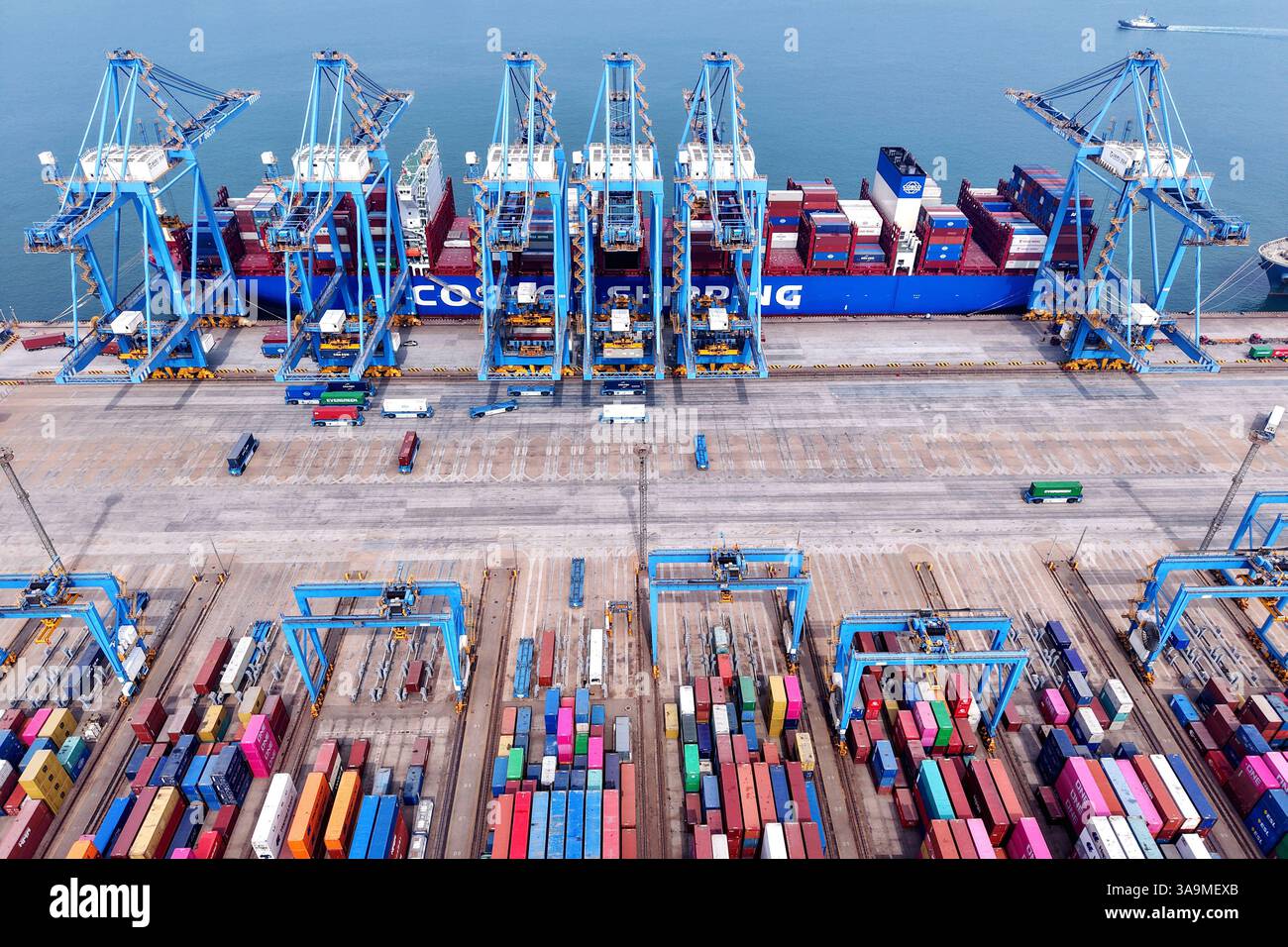 QINGDAO, CHINA - MARCH 31, 2025 - A cargo ship loads foreign trade ...