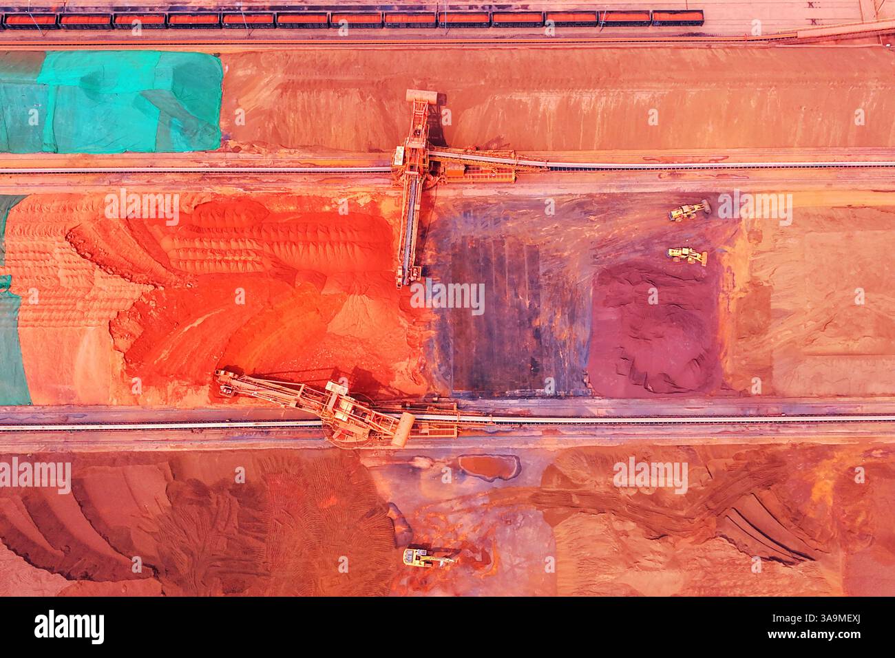 QINGDAO, CHINA - MARCH 31, 2025 - A storage yard collates imported iron ...