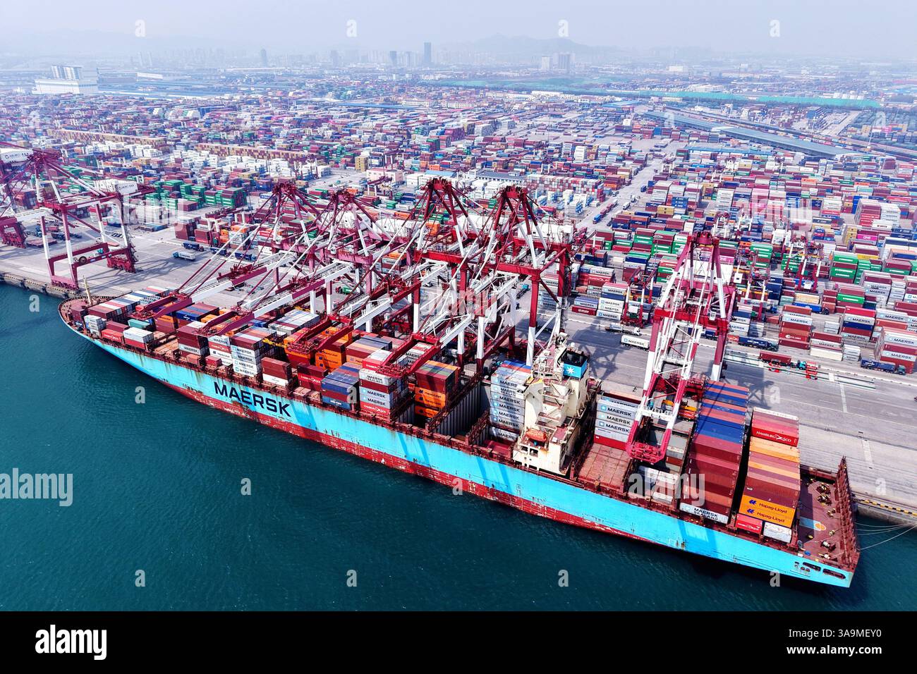 QINGDAO, CHINA - MARCH 31, 2025 - A cargo ship loads foreign trade ...