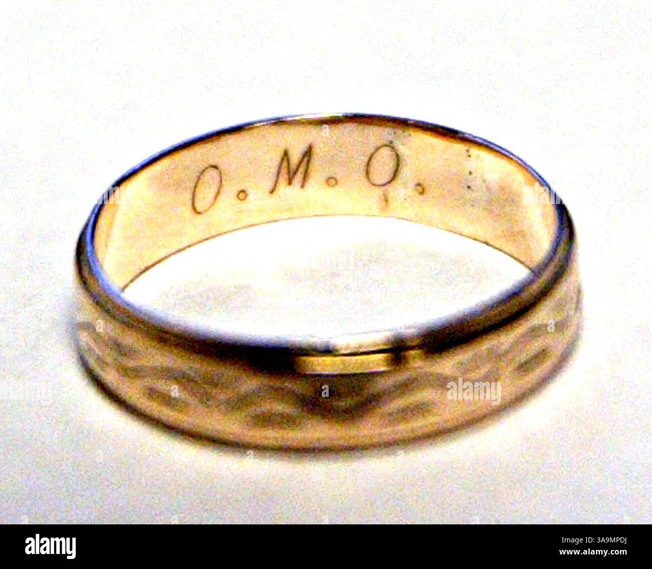 This ring with the initials O. M. O inside of the band was worn by a ...