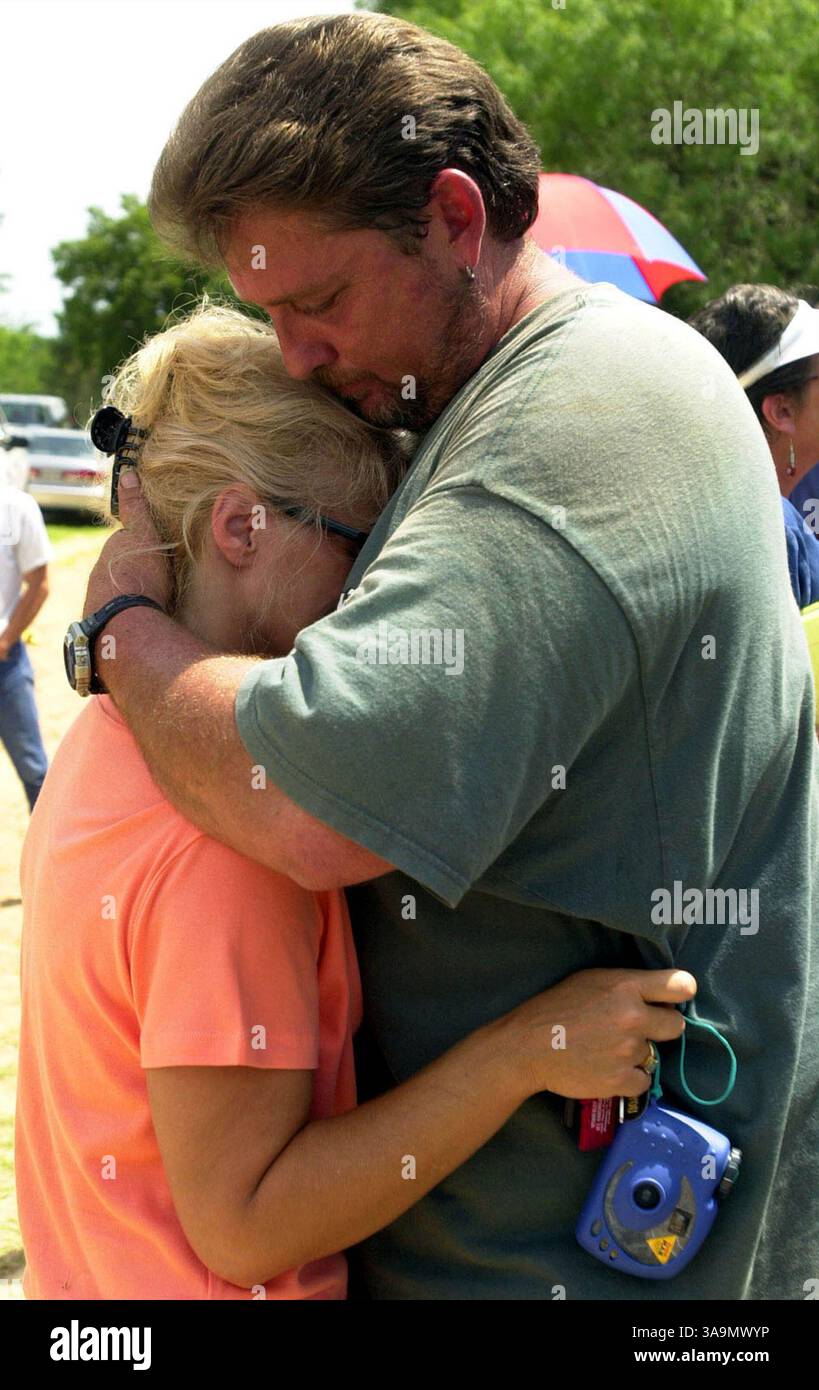 Jul 12, 2002; Canyon Lake, TX, USA; WILLIAM SASSER comforts his wife ...