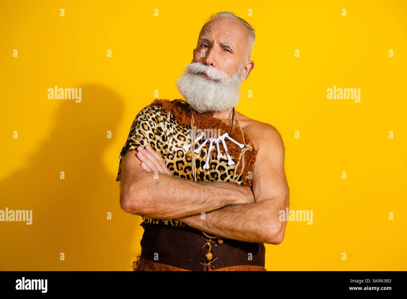 Photo of serious strong caveman cross hands tribe chef isolated bright ...