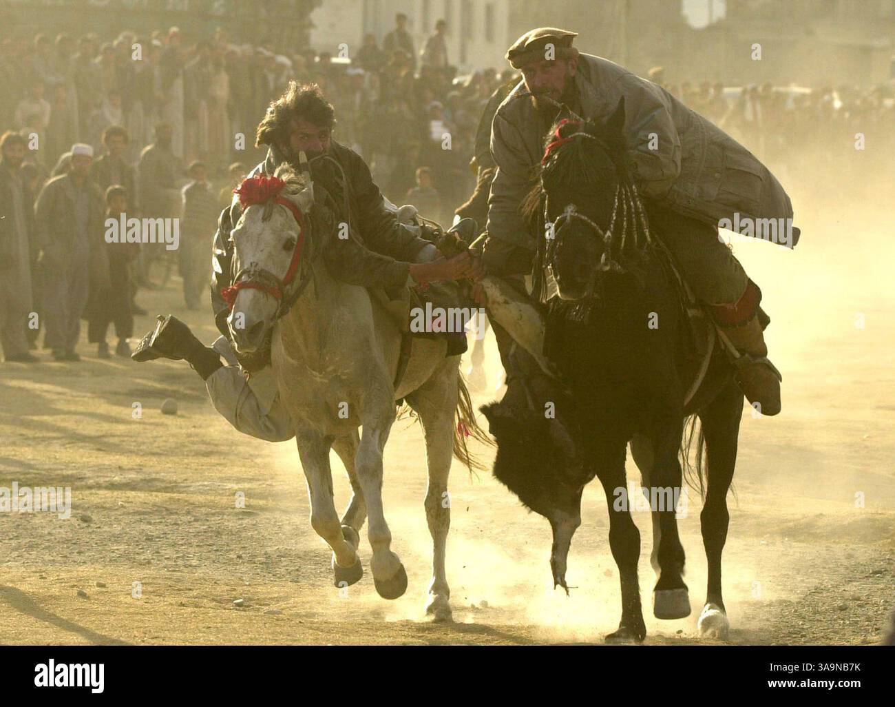 Dec 28, 2001; Kabul, Afghanistan; Dust fills the air as contestants ...
