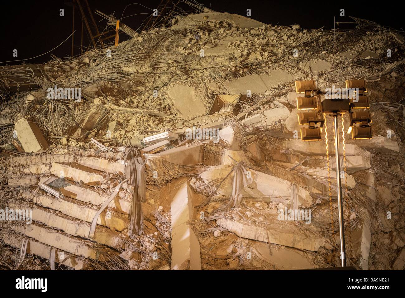 Rescue teams work tirelessly amidst the rubble of a collapsed ...