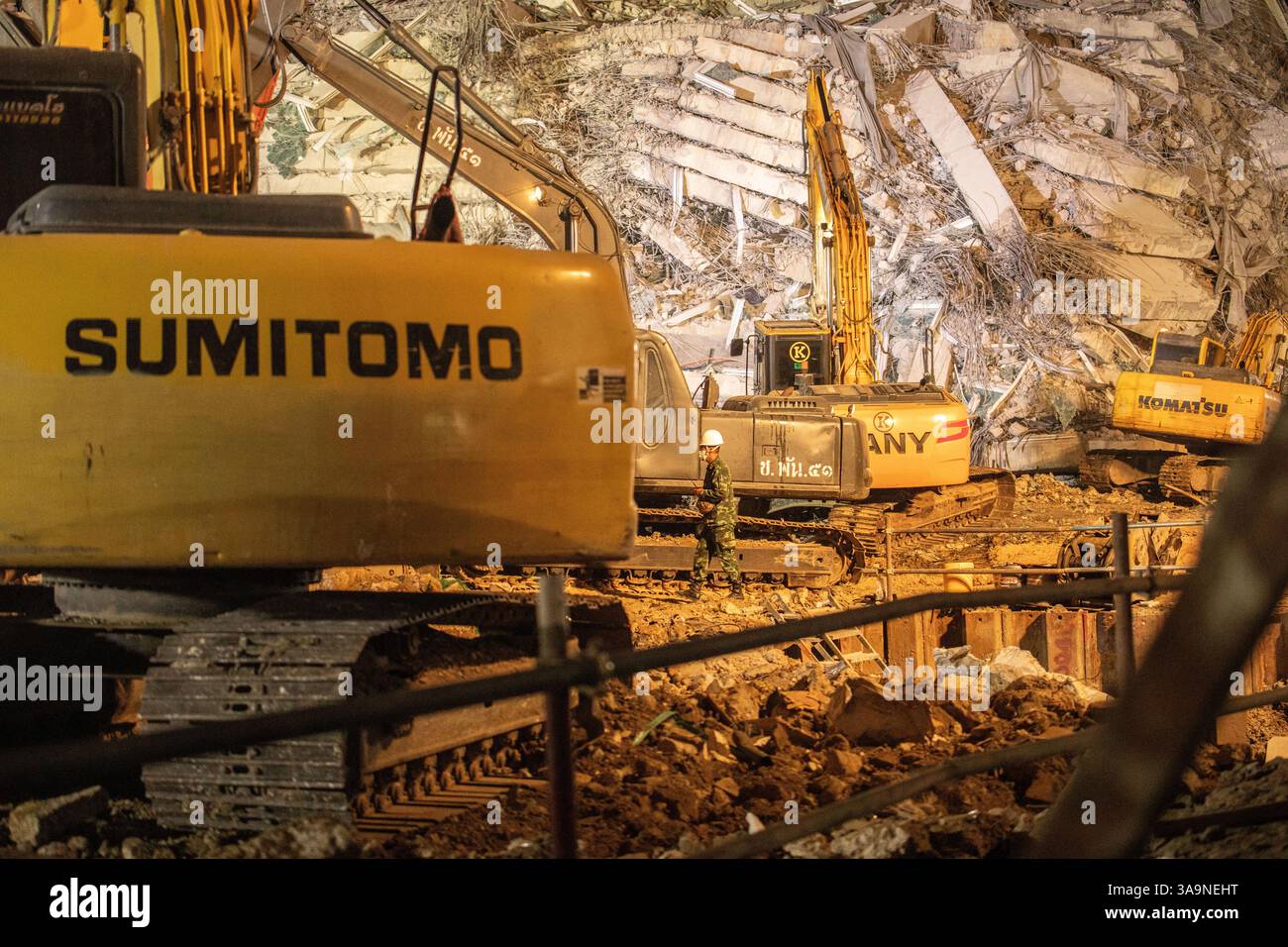 Rescue teams work tirelessly amidst the rubble of a collapsed ...
