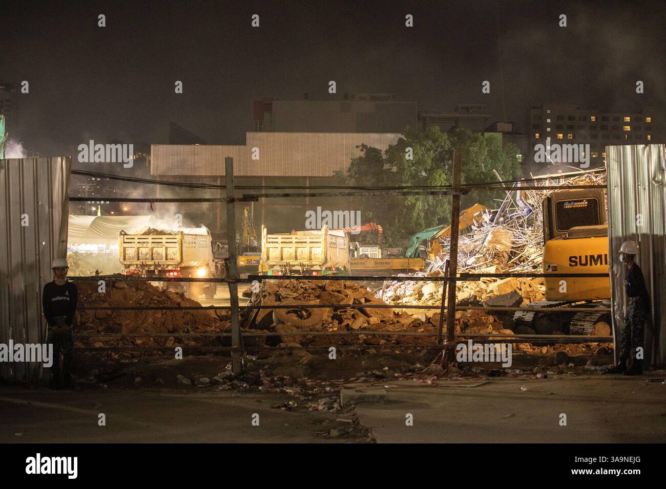 Rescue teams work tirelessly amidst the rubble of a collapsed ...