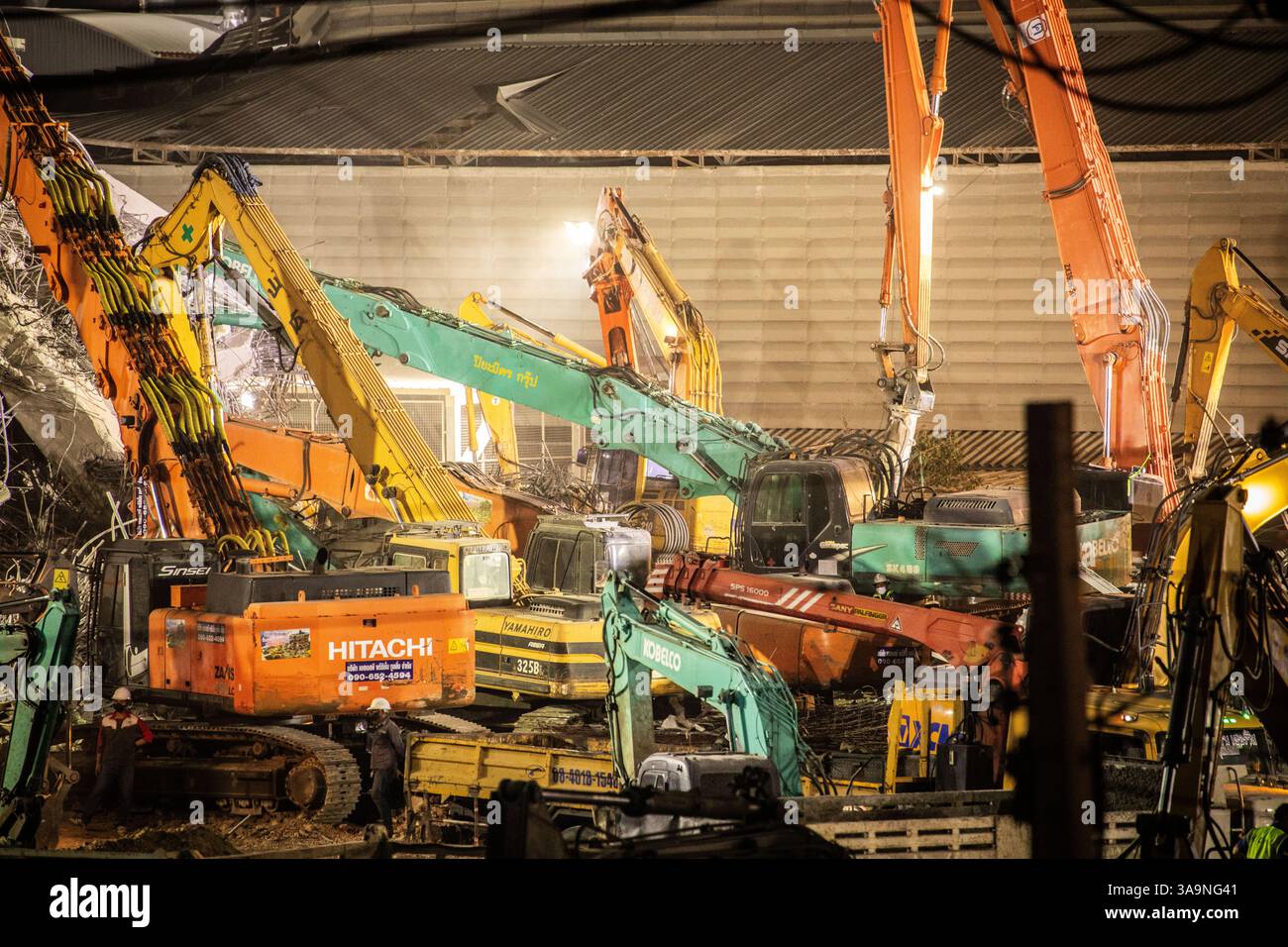 Rescue teams work tirelessly amidst the rubble of a collapsed ...