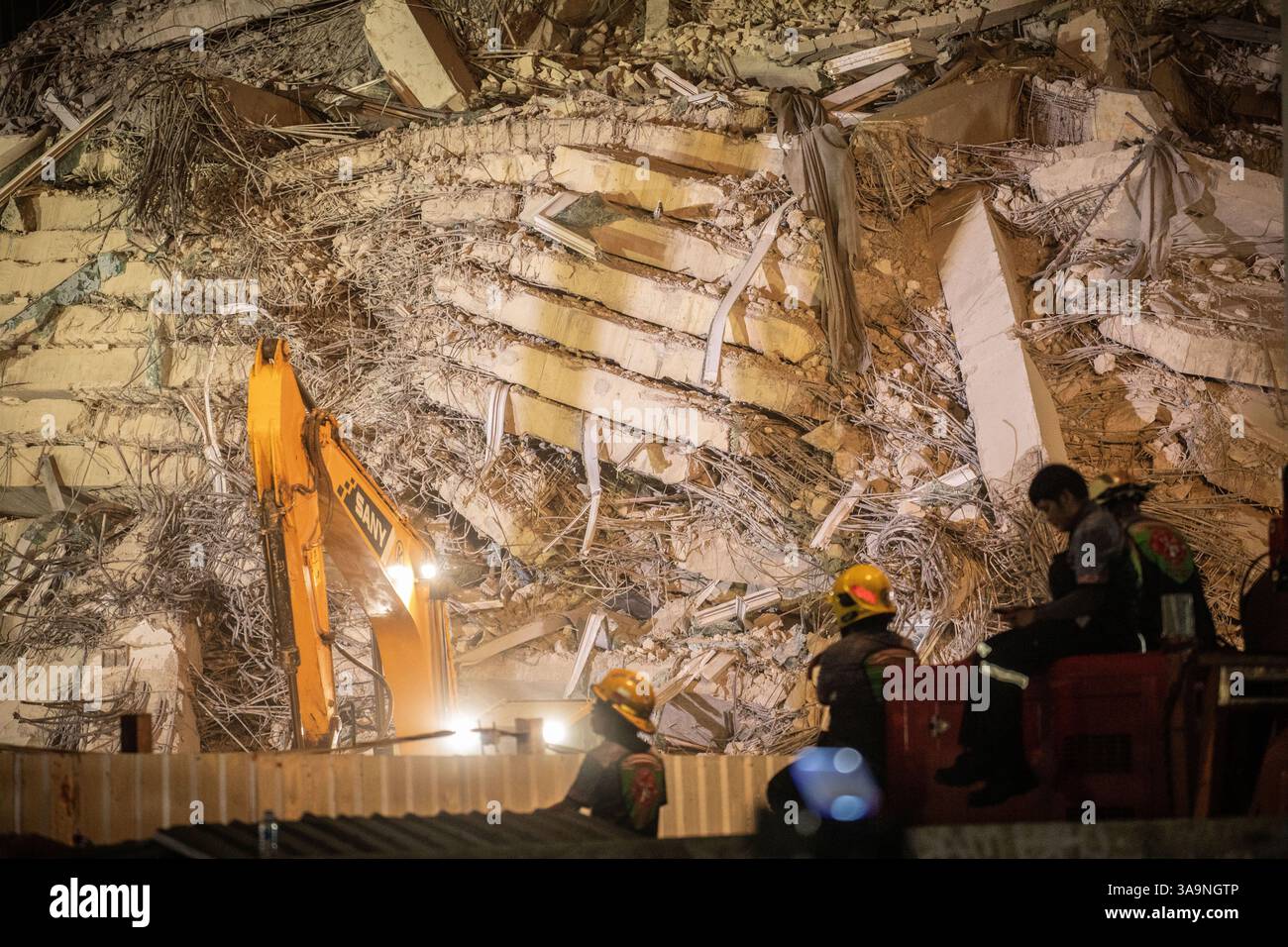 Rescue teams work tirelessly amidst the rubble of a collapsed ...